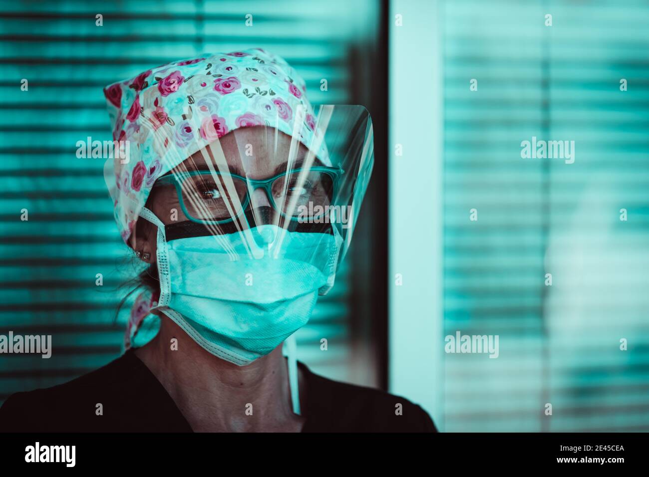 Portrait of a first responder nurse with protective N95 mask and ...