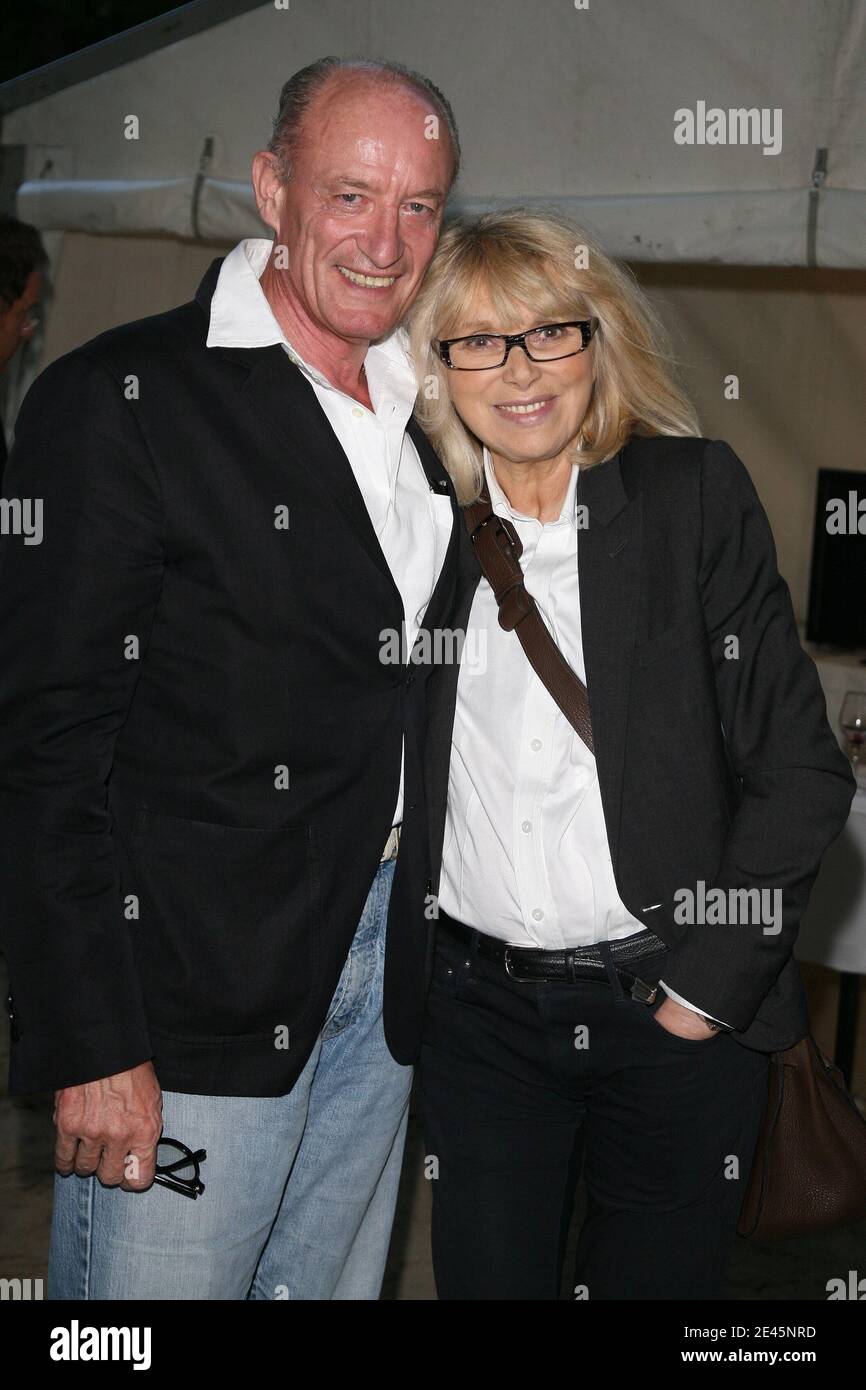 Mireille Darc and her husband Pascal Desprez attend the opening of Photographer Jean-Marie ...