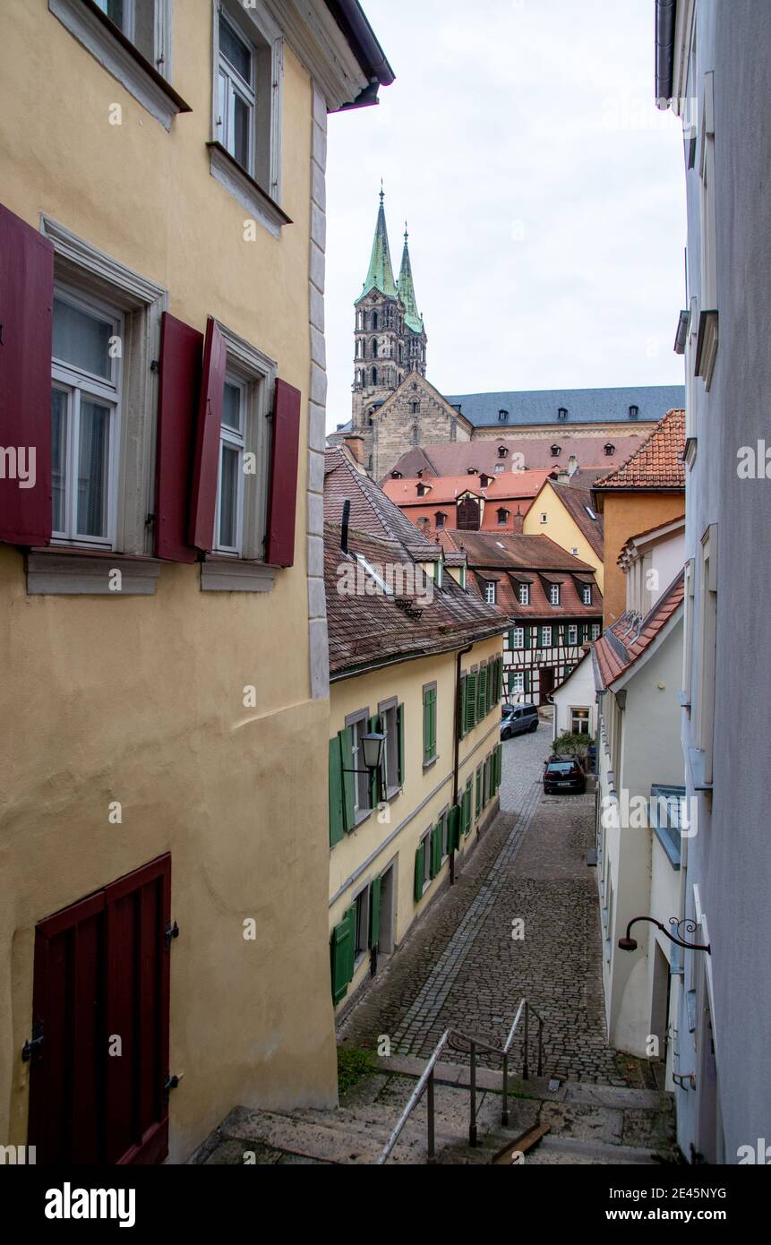 View into a narrow alley of the World Heritage city of Bamberg with the ...