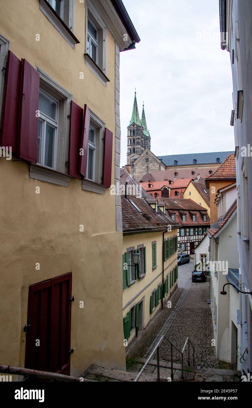 View into a narrow alley of the World Heritage city of Bamberg with the ...
