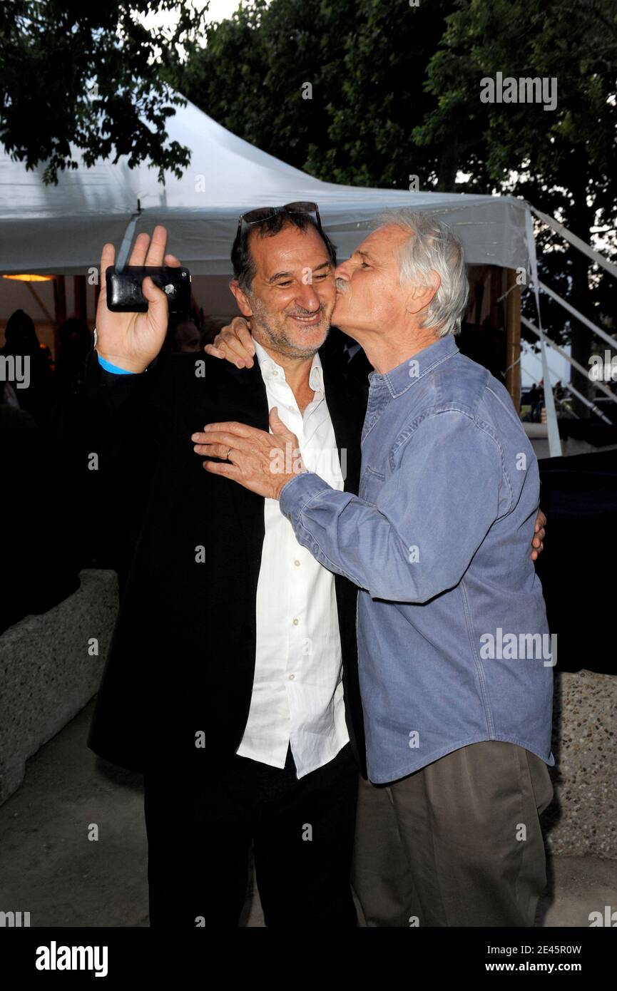French photographer Yann Arthus-Bertrand (R) and his music composer ...