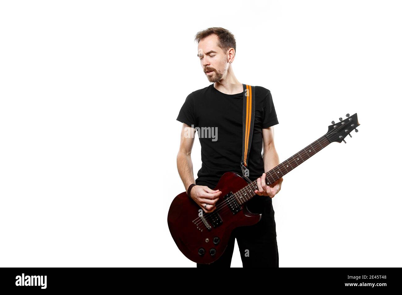 Young man playing electric guitar isolated on white background Stock ...