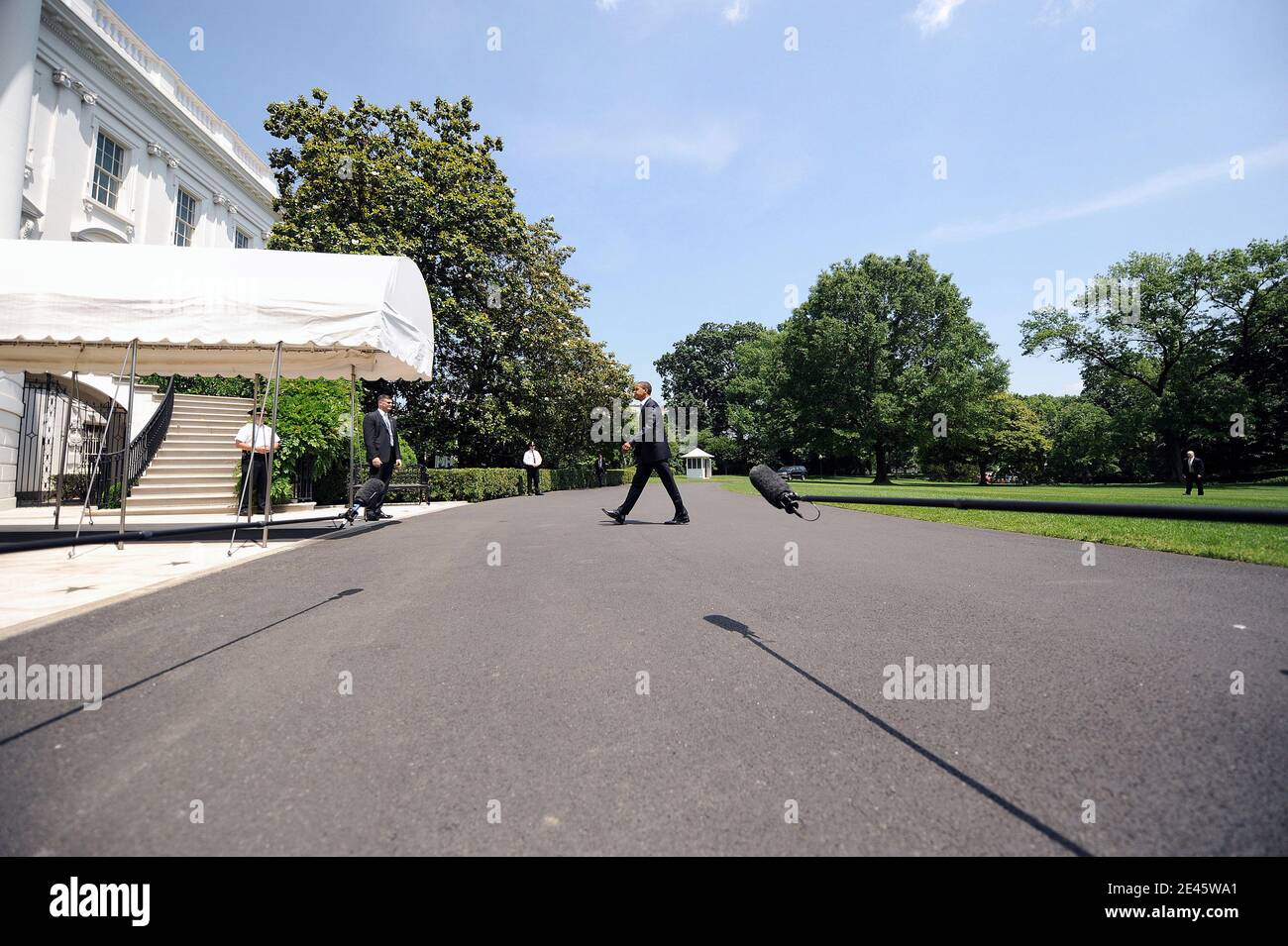 US President Barack Obama enters the White House in Washington, DC, on ...