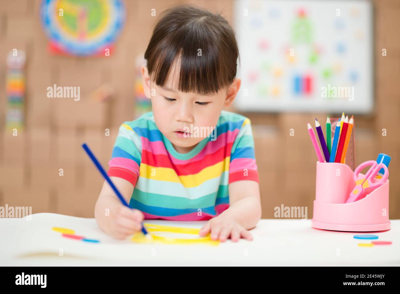 young girl practice drawing different shapes for homeschooling Stock ...