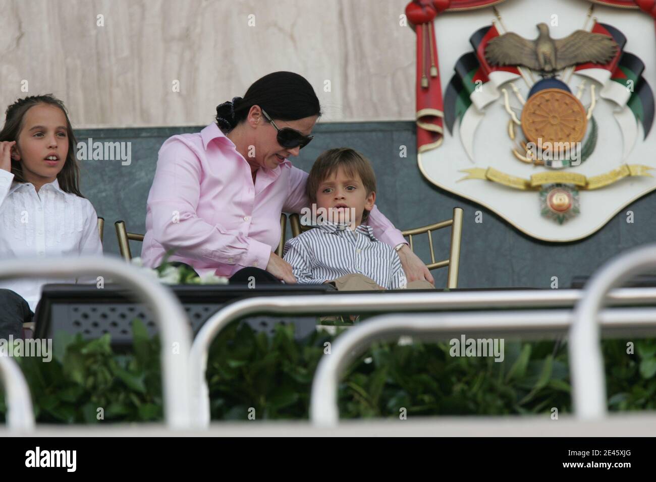 Princess Salma, a nanny and Prince Hashem seen during a ceremony in the ...