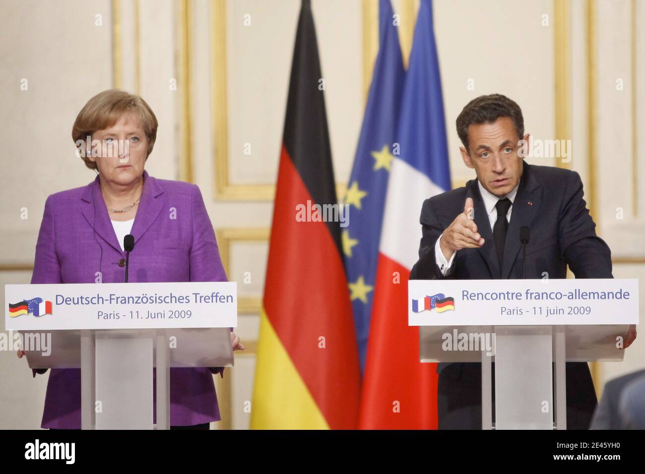 French President Nicolas Sarkozy and German Chancellor Angela Merkel ...