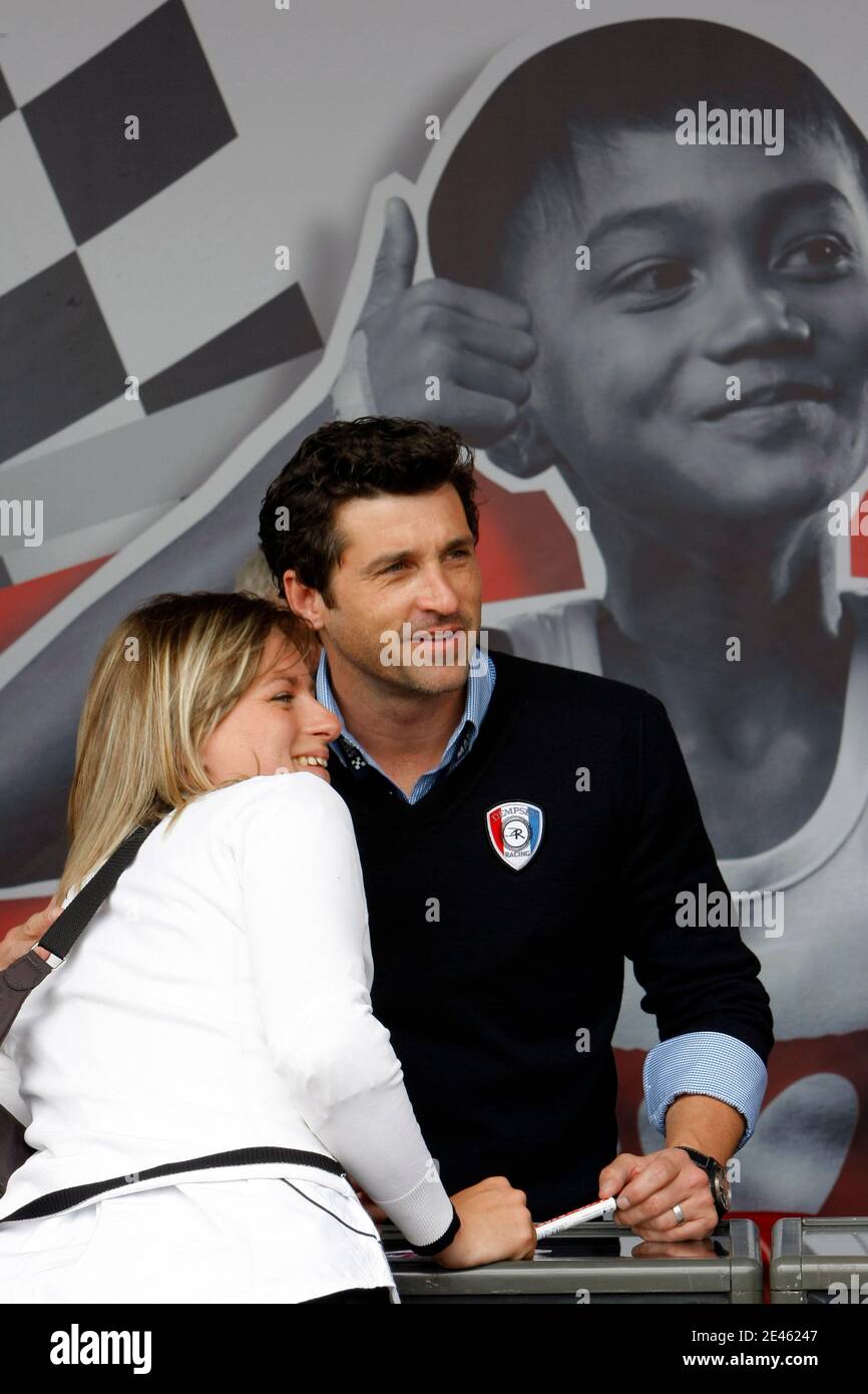 Actor Patrick Dempsey signs autographs to his numerous fans during the ...