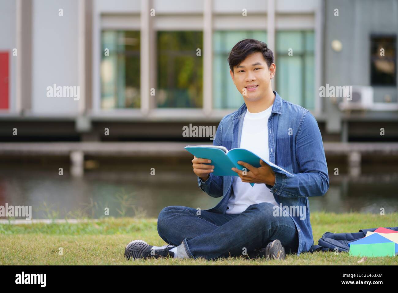 Asian boy reading book hi-res stock photography and images - Alamy