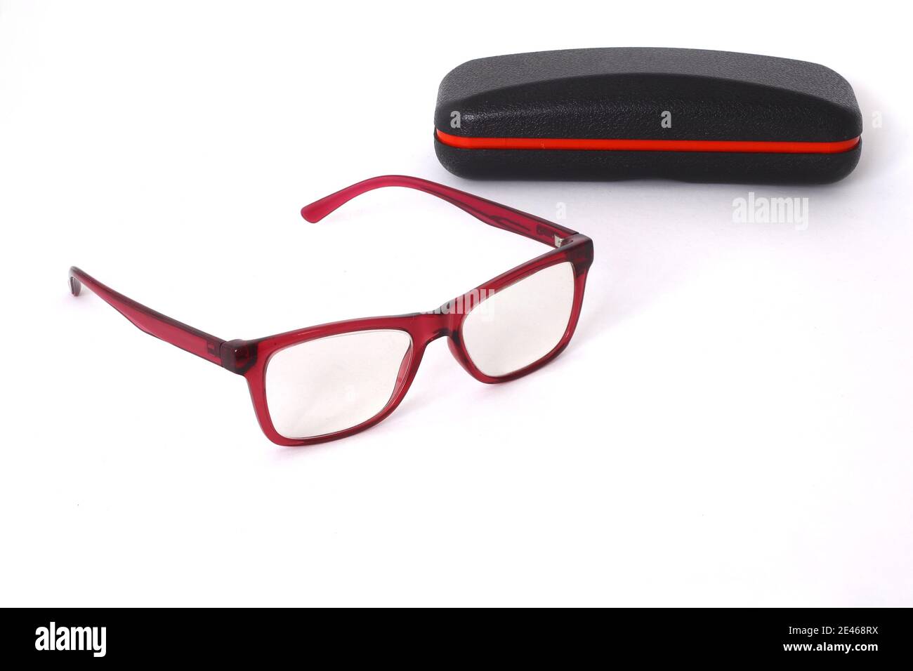 Transparent optical glasses with a eyeglass case on an isolated white ...