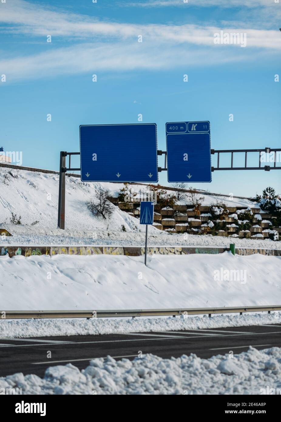 View of a road covered with snow during winter storm Filomena in Madrid ...