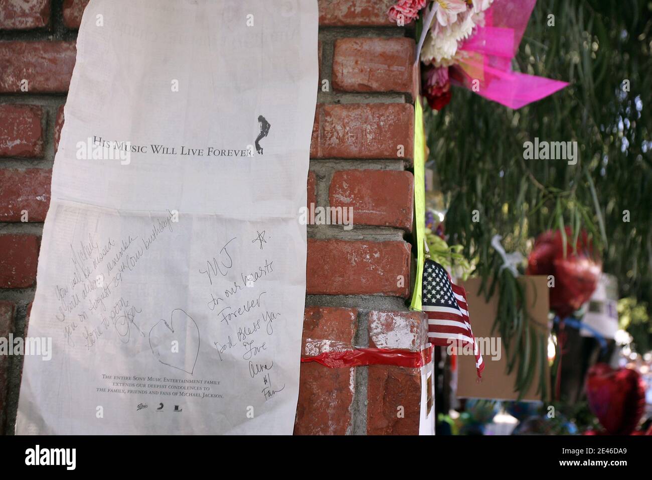 Fans and Media wait outside the entrance to the Jackson family compound ...