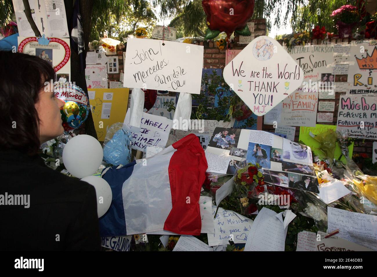 Fans and Media wait outside the entrance to the Jackson family compound ...