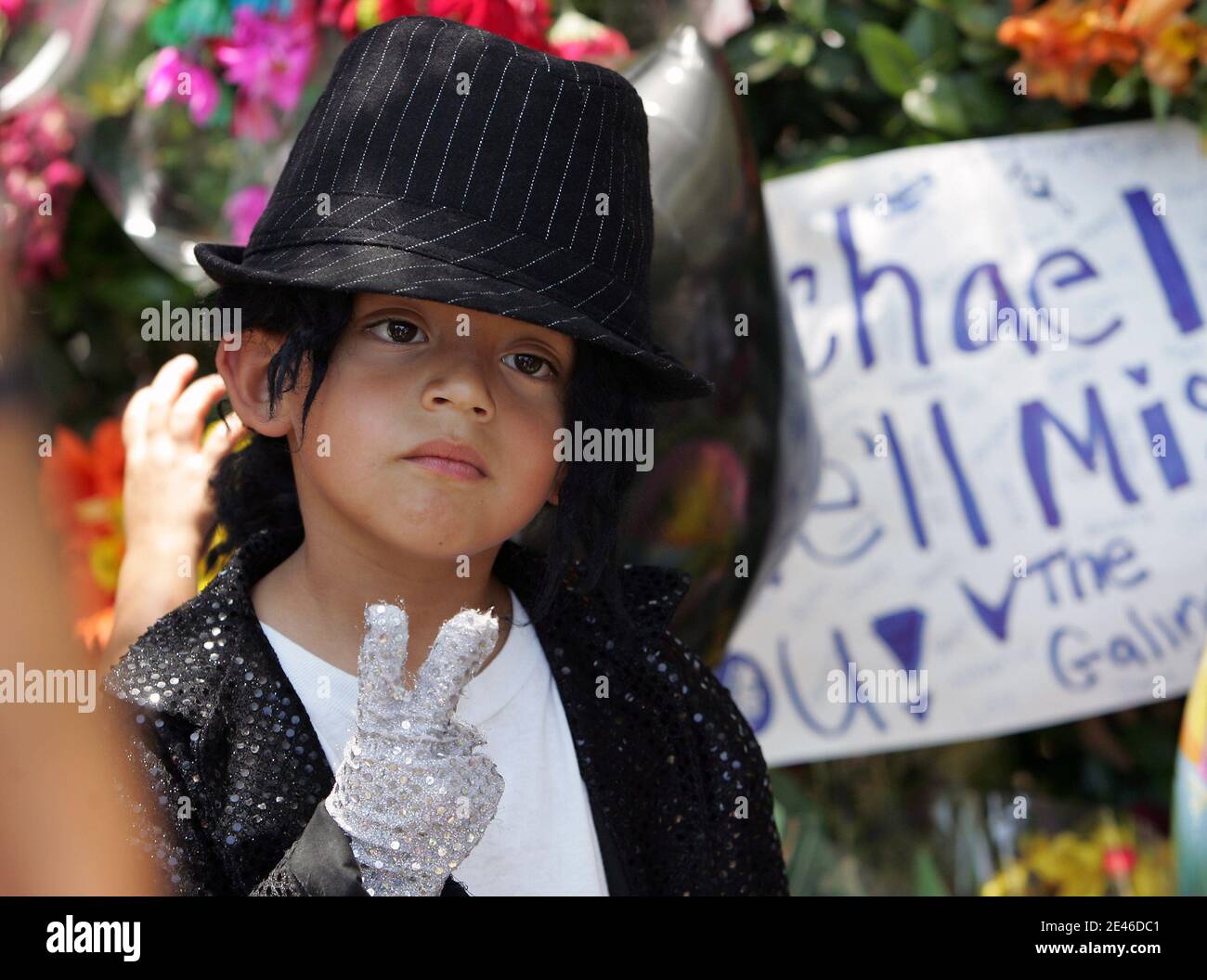 Fans and Media wait outside the entrance to the Jackson family compound ...