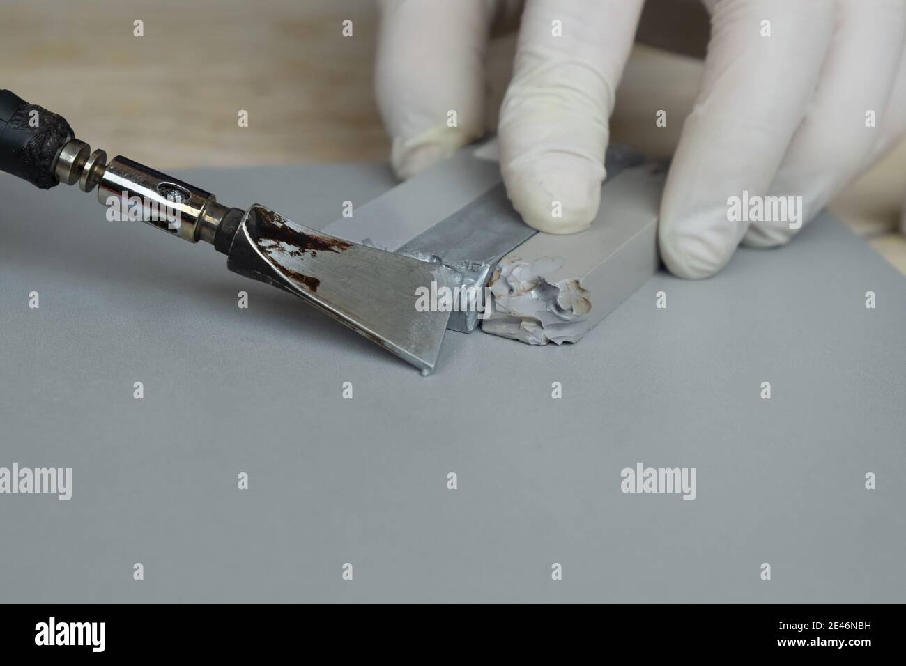 wax pencils and a soldering iron close-up,tools for repairing chips and ...