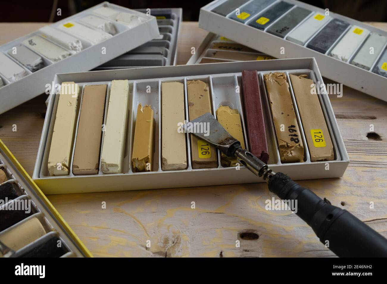 a set of wax pencils and a soldering iron for repairing chips and ...