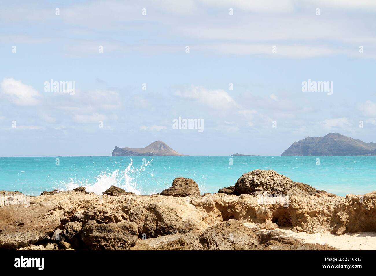 Ocean wave hitting rocks in Hawaii Stock Photo - Alamy