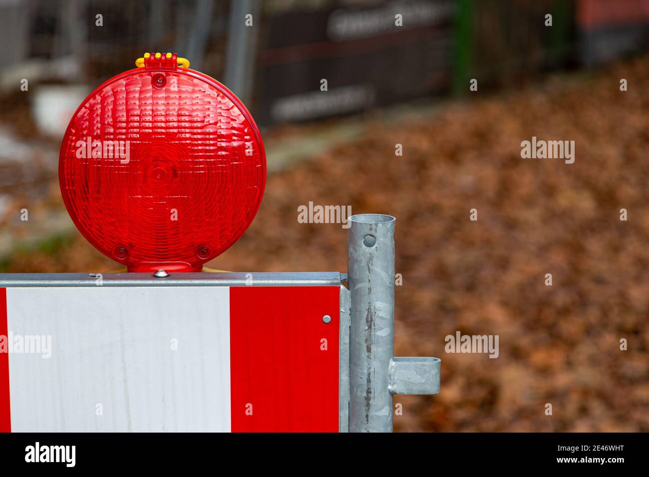 Close-up of red warning lights with street barriers Stock Photo - Alamy