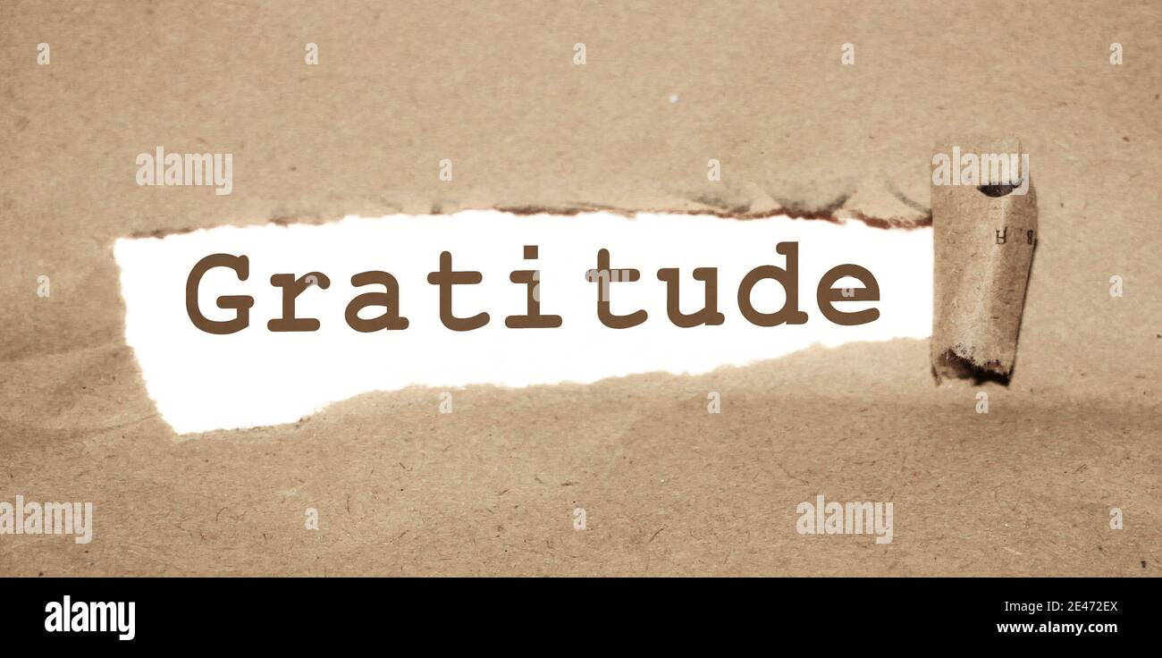 Word Gratitude appearing behind torn ripped brown paper Stock Photo - Alamy