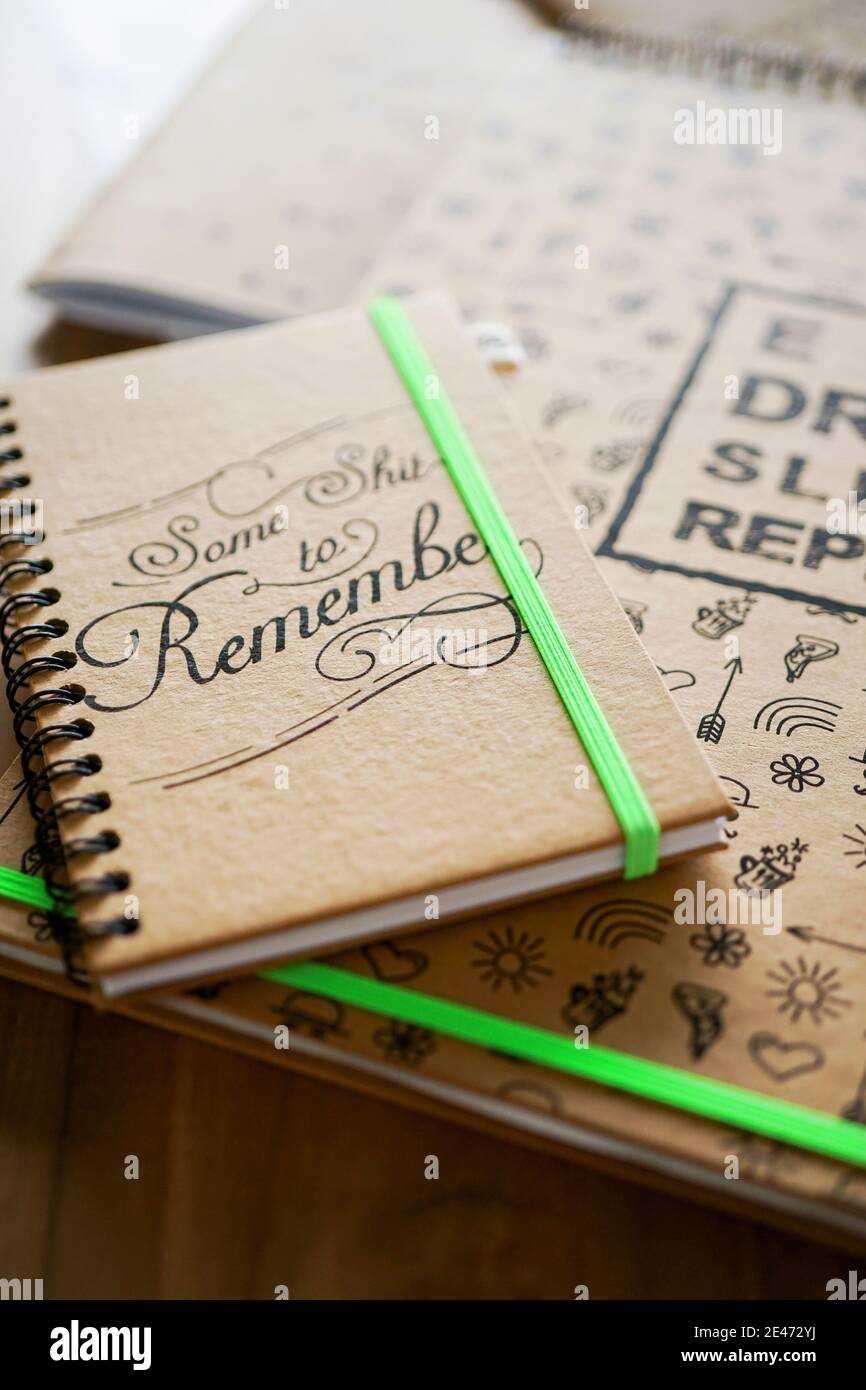 Lots of notebooks on wooden table and top view Stock Photo - Alamy