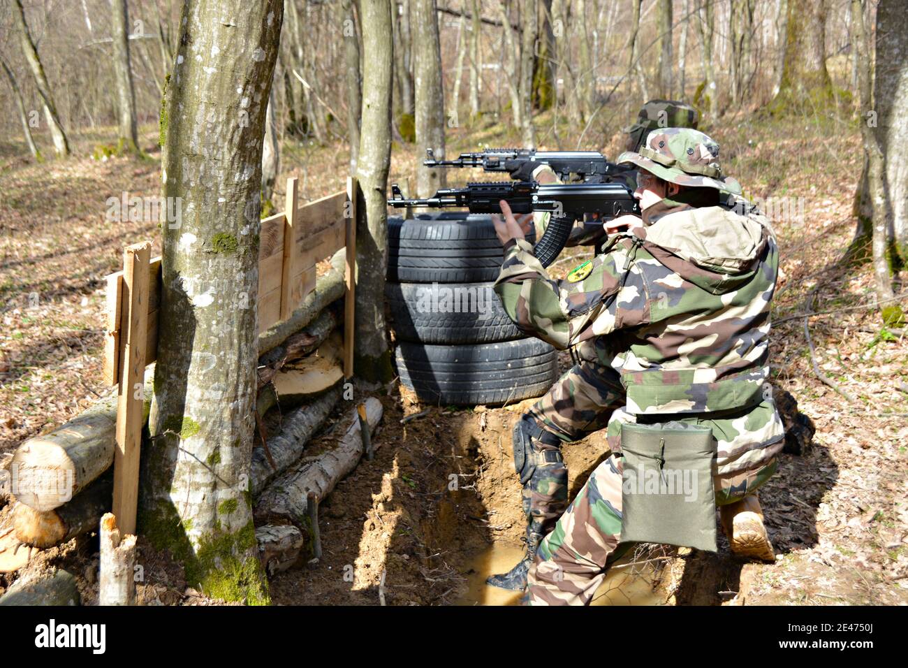 Closeup of special forces soldier in a forest aiming and shooting Stock ...