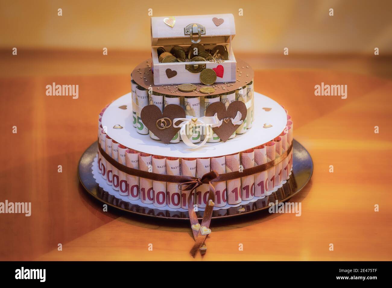 wedding cake made of money , treasure chest Stock Photo - Alamy