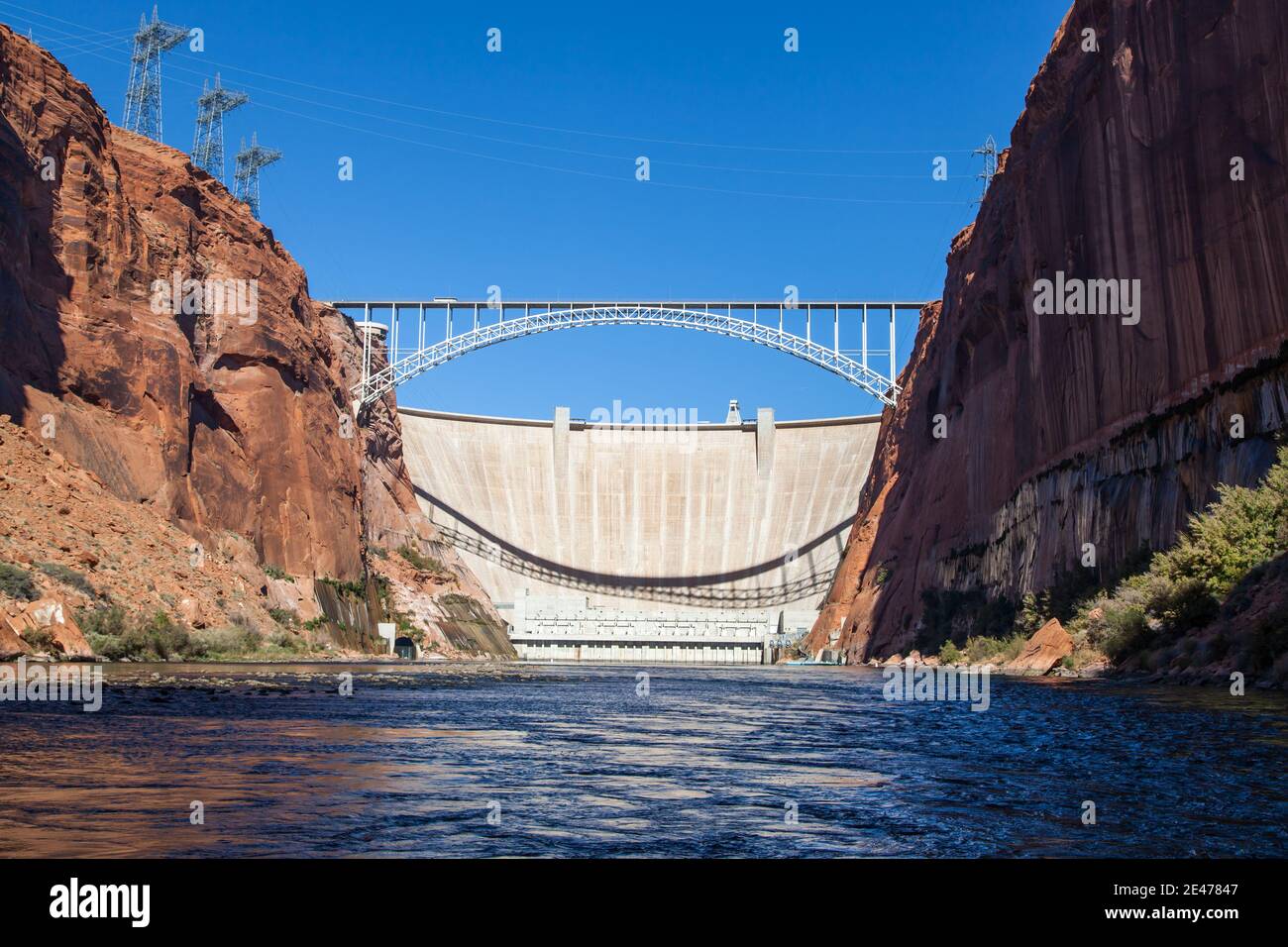 The Glen Canyon Dam holding back Lake Powell and the Glen Canyon Bridge ...