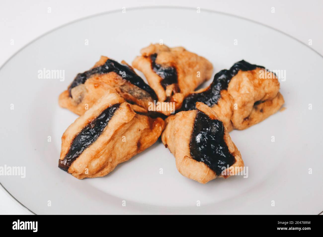 Fried tofu or tahu with petis sauce in white platebackground, javanese ...