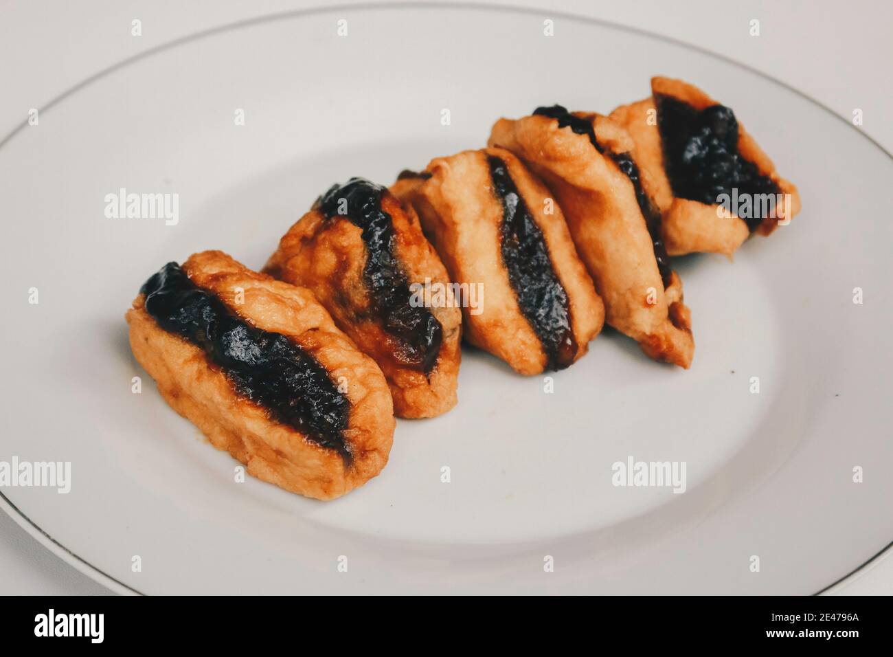 Fried tofu or tahu with petis sauce in white platebackground, javanese ...