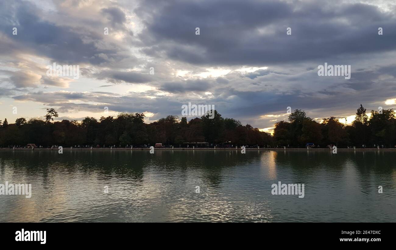 Beautiful view of a forest near sea under a cloudy sky Stock Photo - Alamy