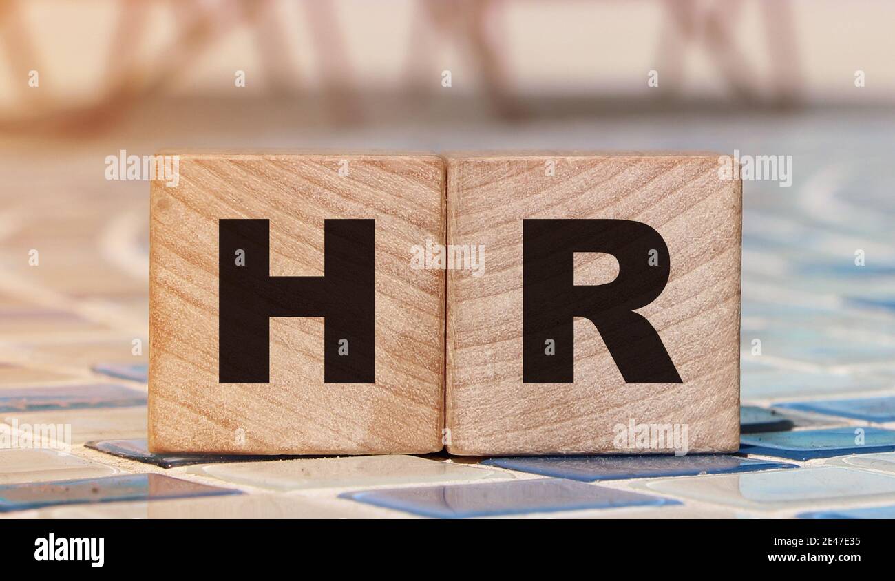 Wooden cube block building the abbreviation HR, represent Human ...