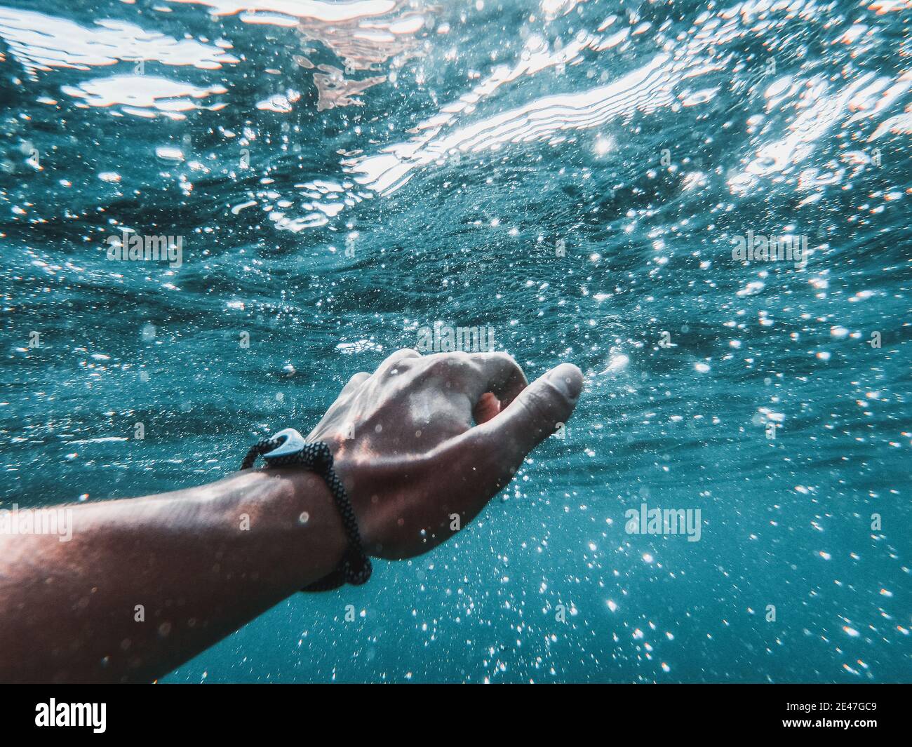 Hand of a person swimming underwater Stock Photo - Alamy