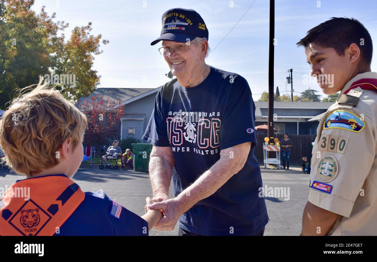 FRESNO, UNITED STATES - Nov 11, 2016: A photo of a Cub Scout shaking ...