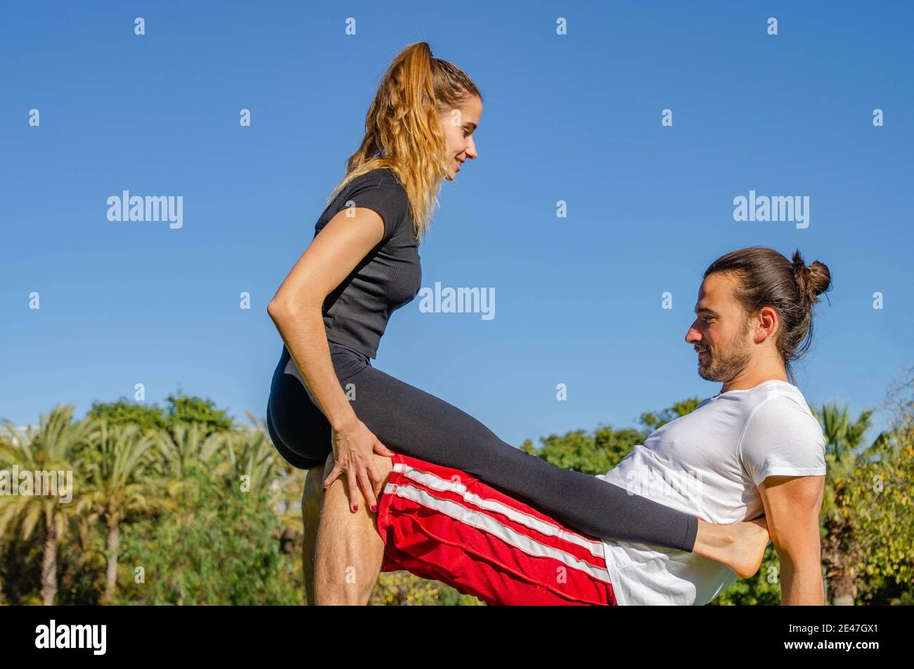Gymnast Couple Boyfriend and Girlfriend Practicing Acro Yoga Poses With ...