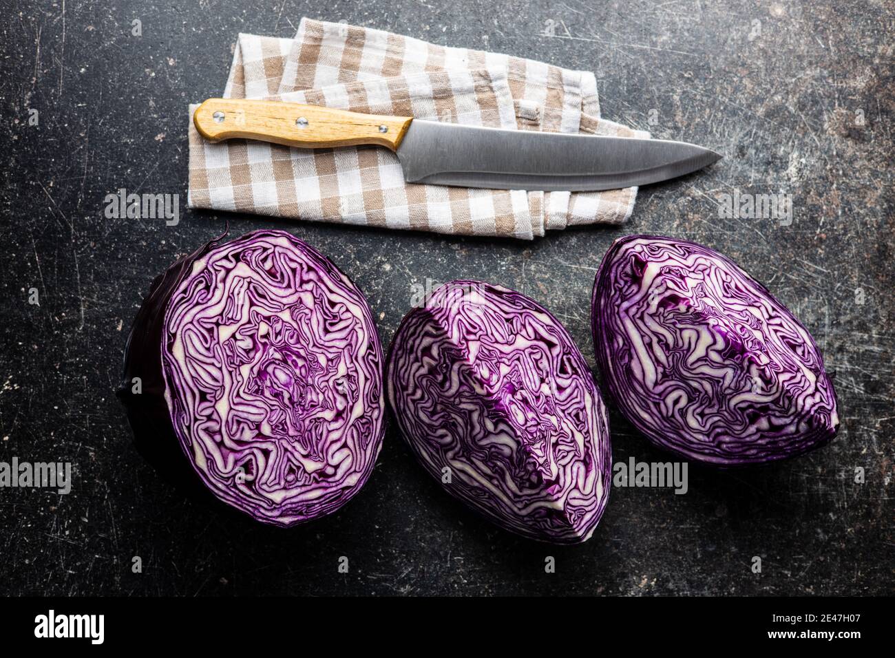 Fresh red cabbage on black table. Top view Stock Photo - Alamy