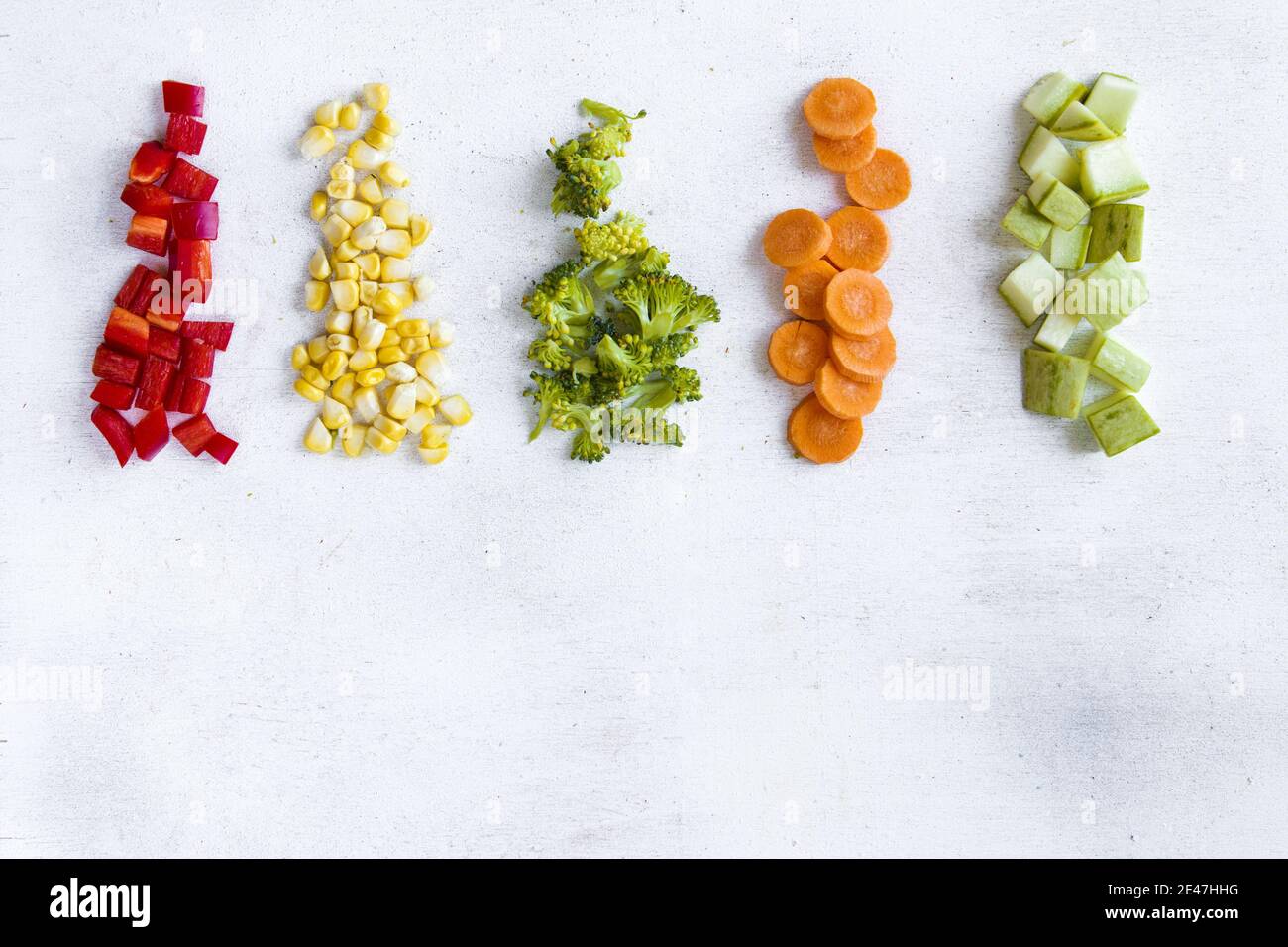 Overhead shot of chopped vegetables on the grey background Stock Photo ...