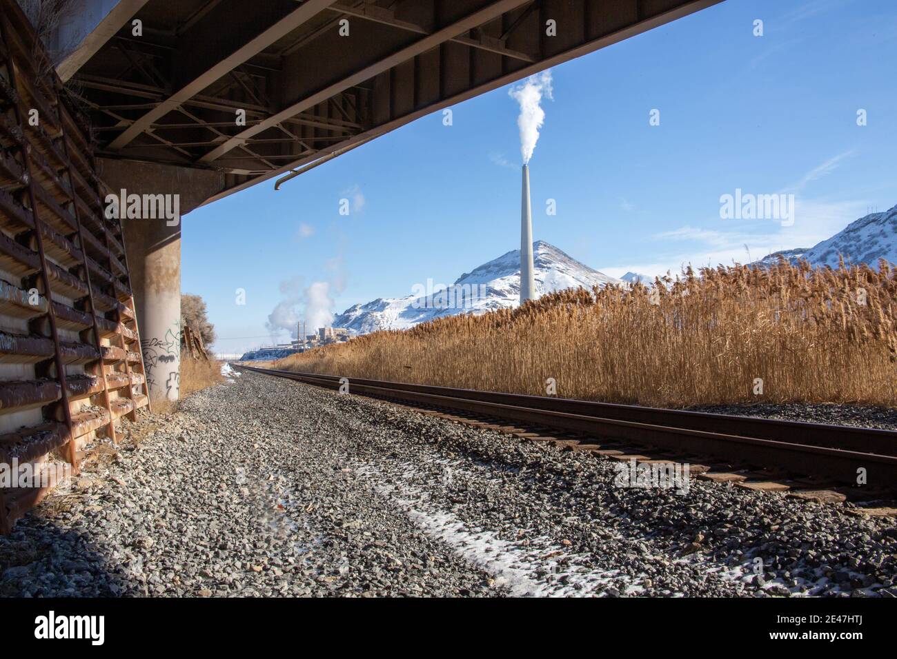 Kennecott steam stack tower with mountains in Stock Photo - Alamy