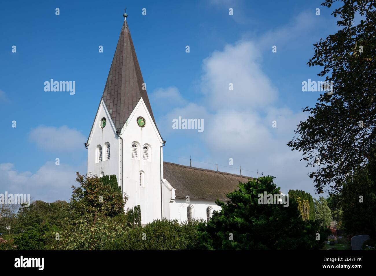Nebel St.-Clemens-Kirche under a blue sky and sunlight in Amrum ...