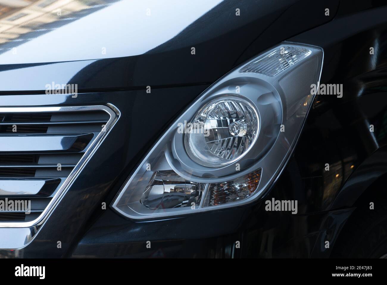 headlight on a black modern car, closeup, and which is very modern and ...