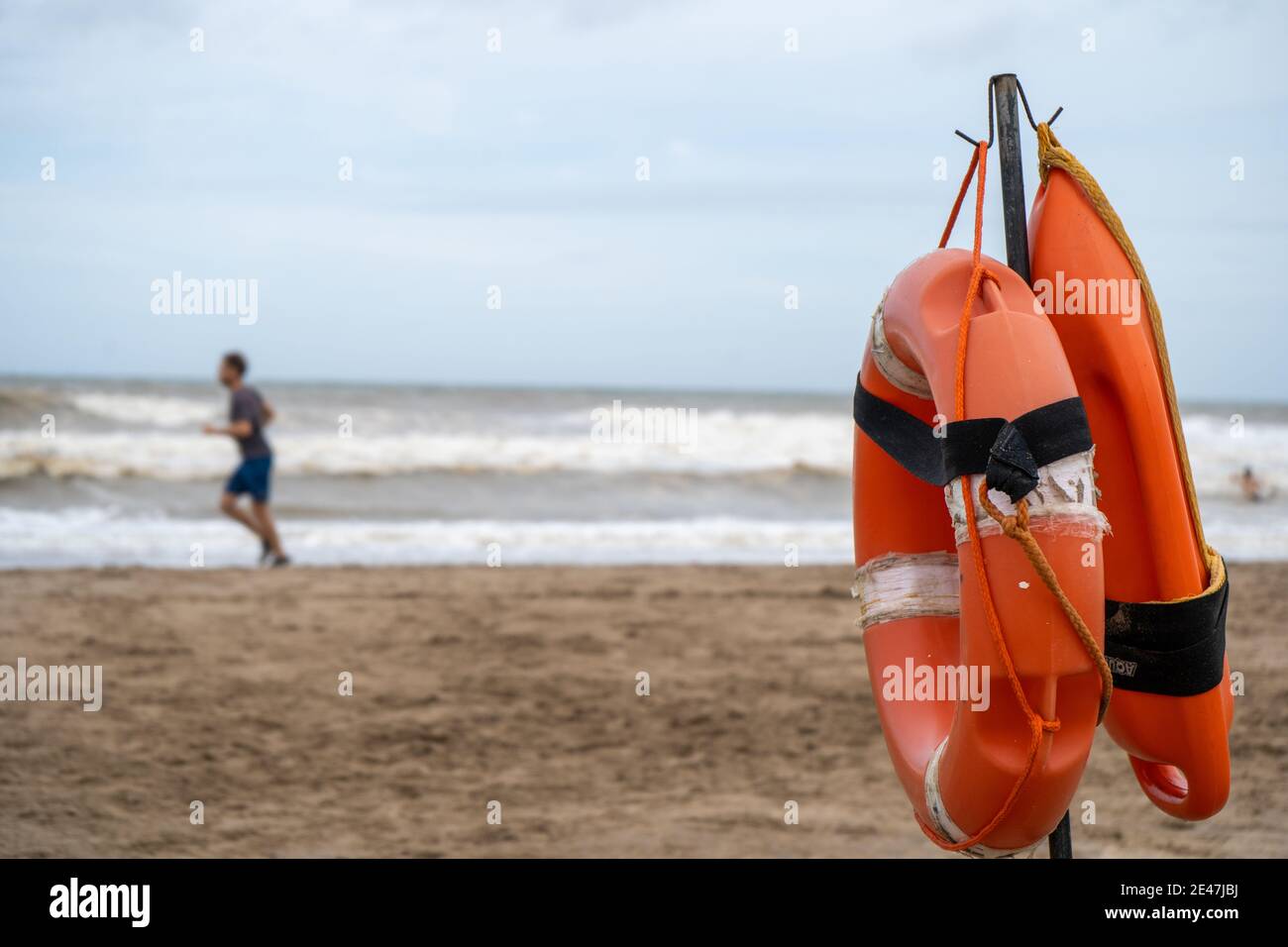 Selective focus shot of plastic life rings on the beach in the Atlantic ...