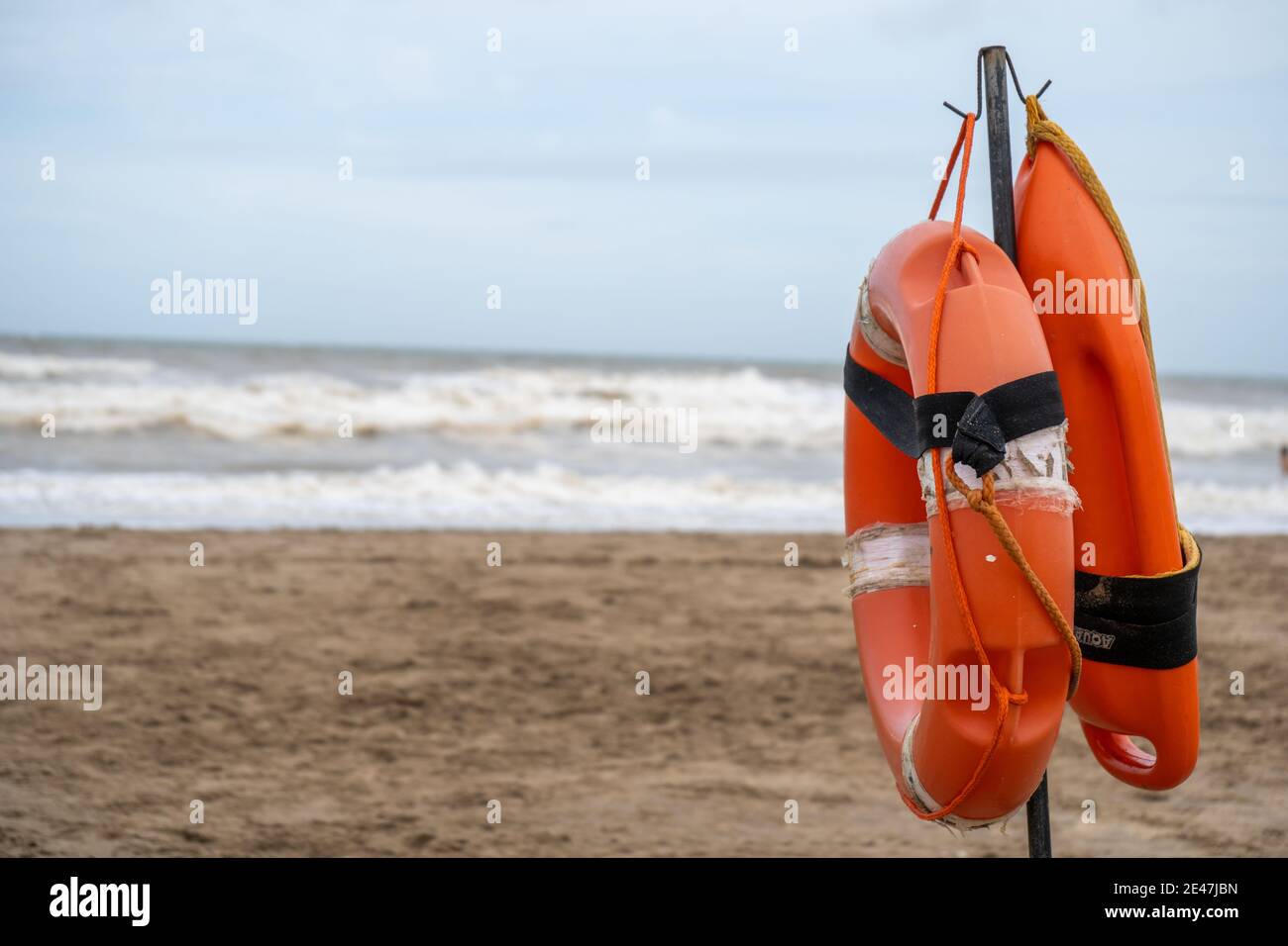 Selective focus shot of plastic life rings on the beach in the Atlantic ...