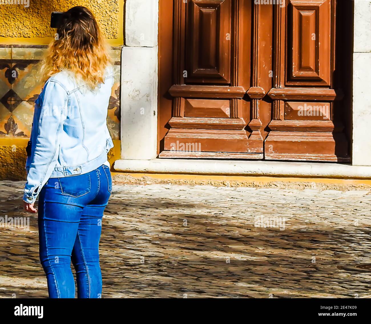 Back view of a young woman Stock Photo - Alamy