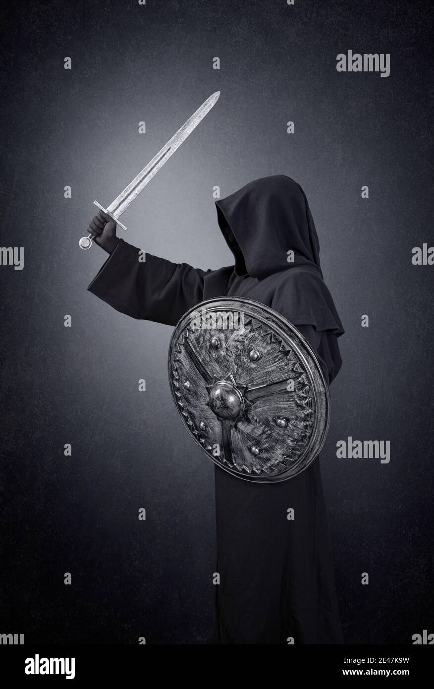 Ghostly figure with sword and round shield in the dark Stock Photo - Alamy