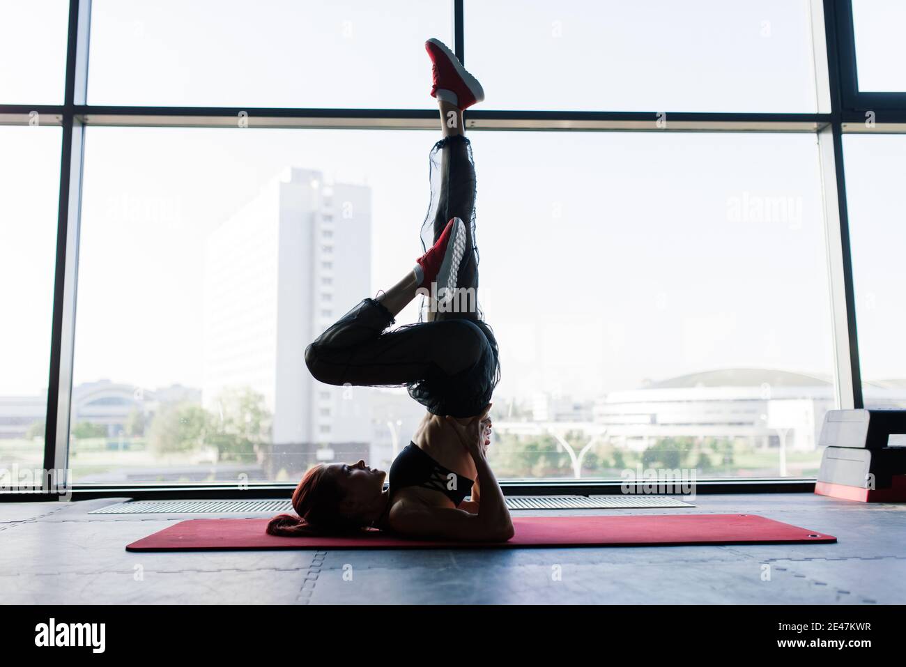 Sportswear lying on back exercise action hi-res stock photography and ...