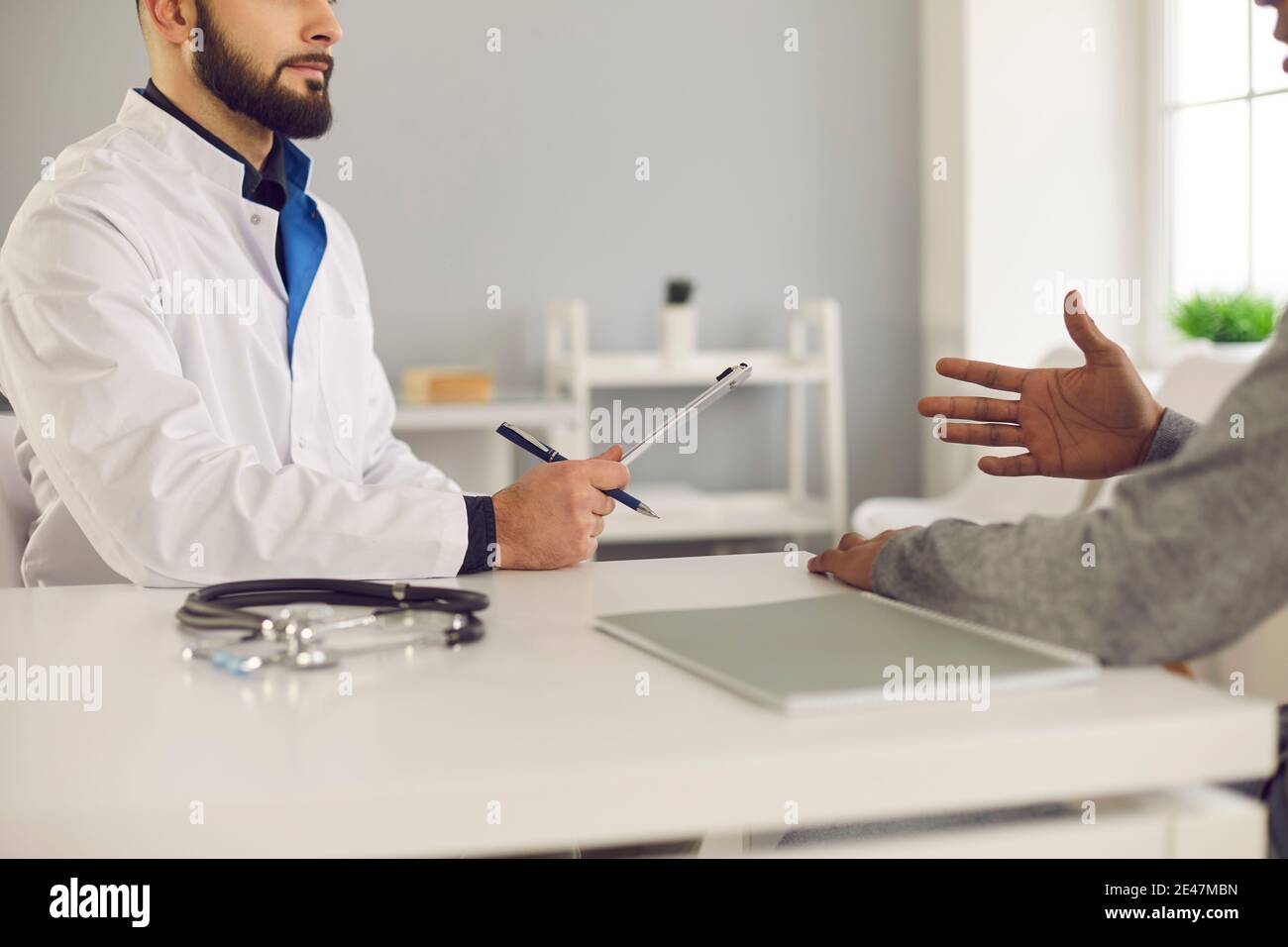 Patient talking to doctor, telling about his symptoms and asking for ...