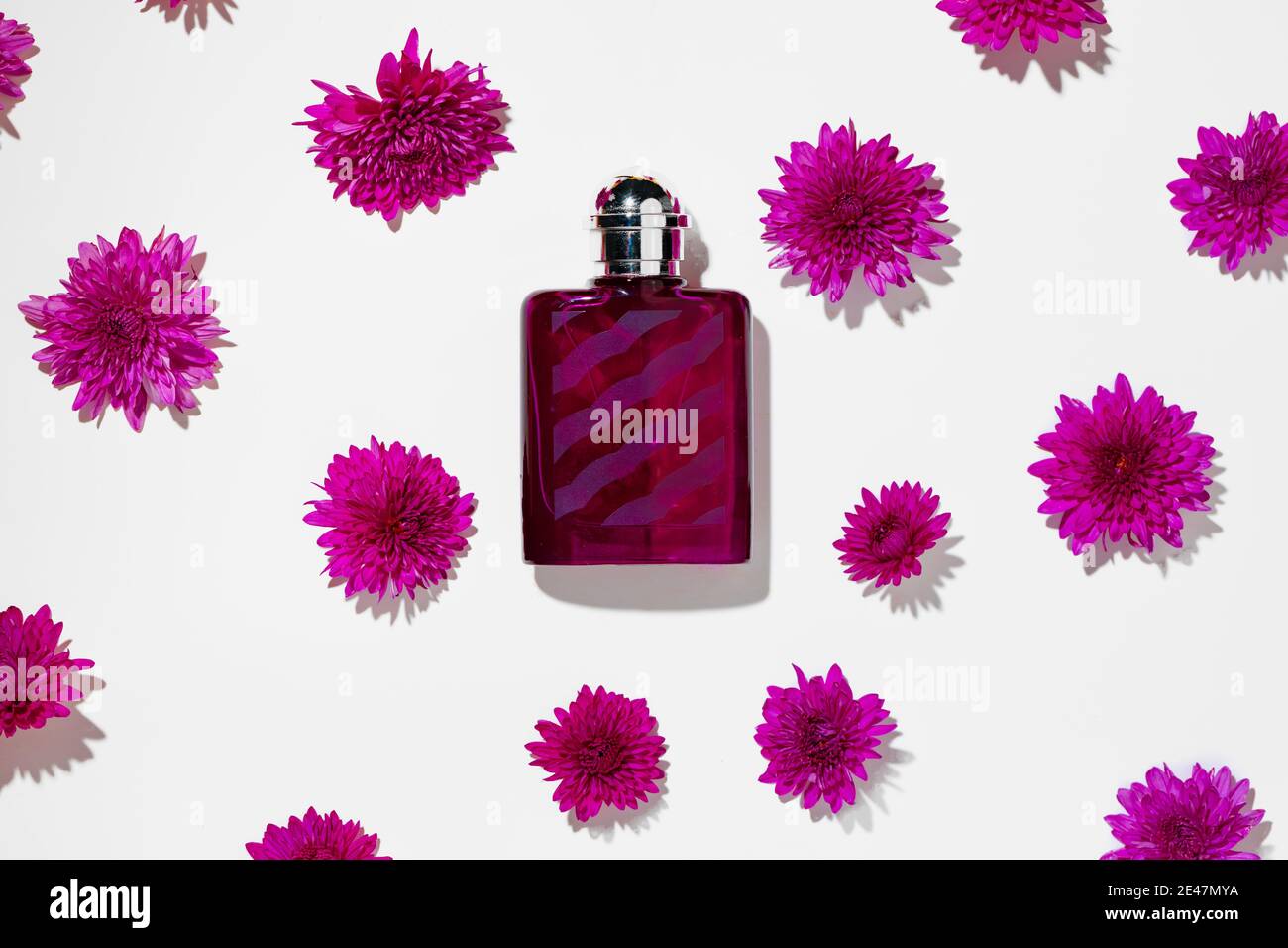 Bottle of fragrance surrounded by flower buds Stock Photo - Alamy