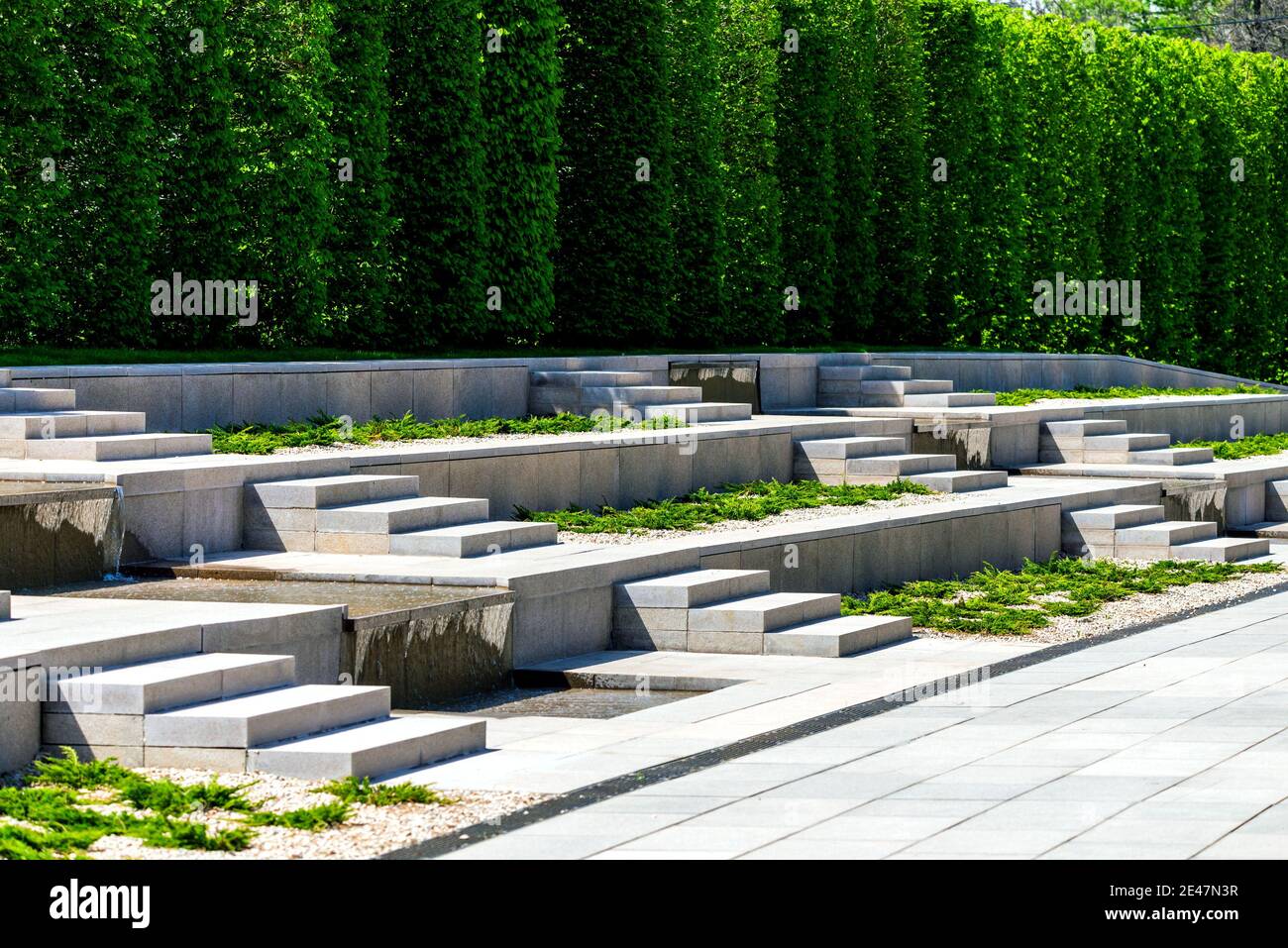 Rounded diagonal terraces on a slope in a modern city park Stock Photo ...
