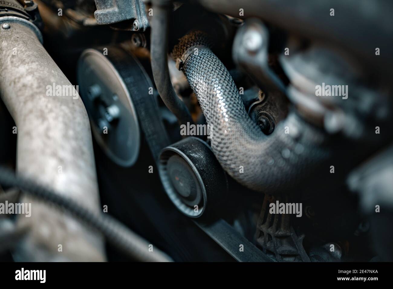 Dirty engine under the hood of a car Stock Photo - Alamy