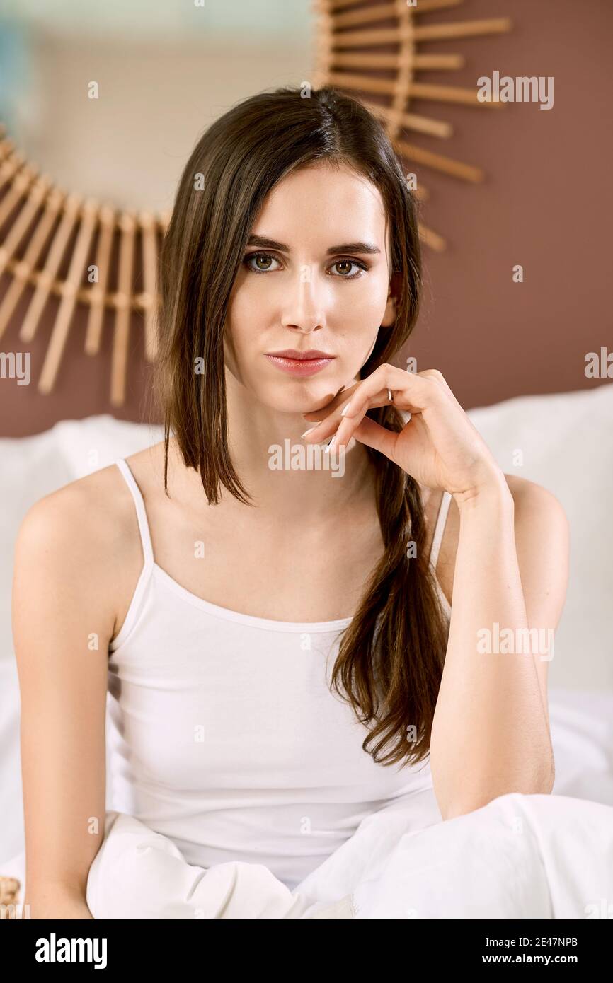 Girl sitting on bed hi-res stock photography and images - Alamy