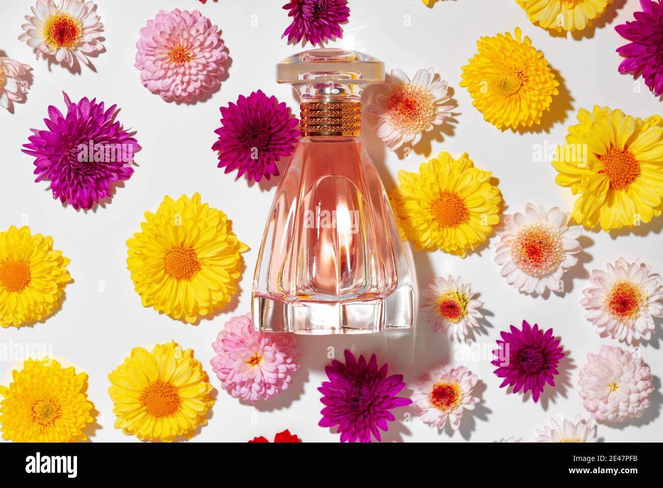 Perfume bottle for women in flower buds Stock Photo - Alamy