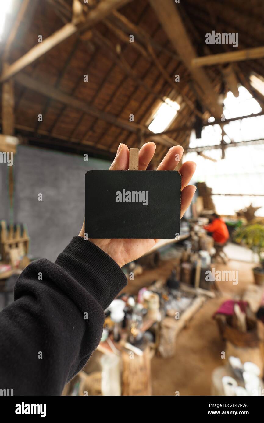 A small blackboard in a cafe On the hand Stock Photo - Alamy